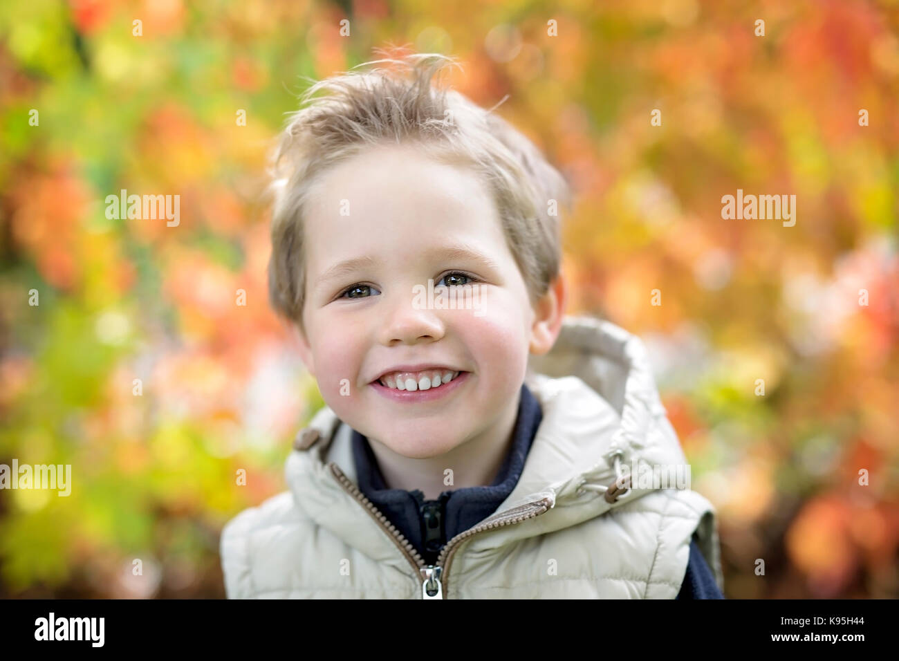 boy in autumn season in a park Stock Photo - Alamy