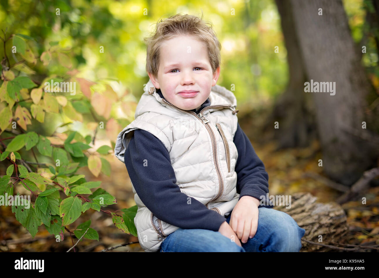 boy in autumn season in a park Stock Photo - Alamy