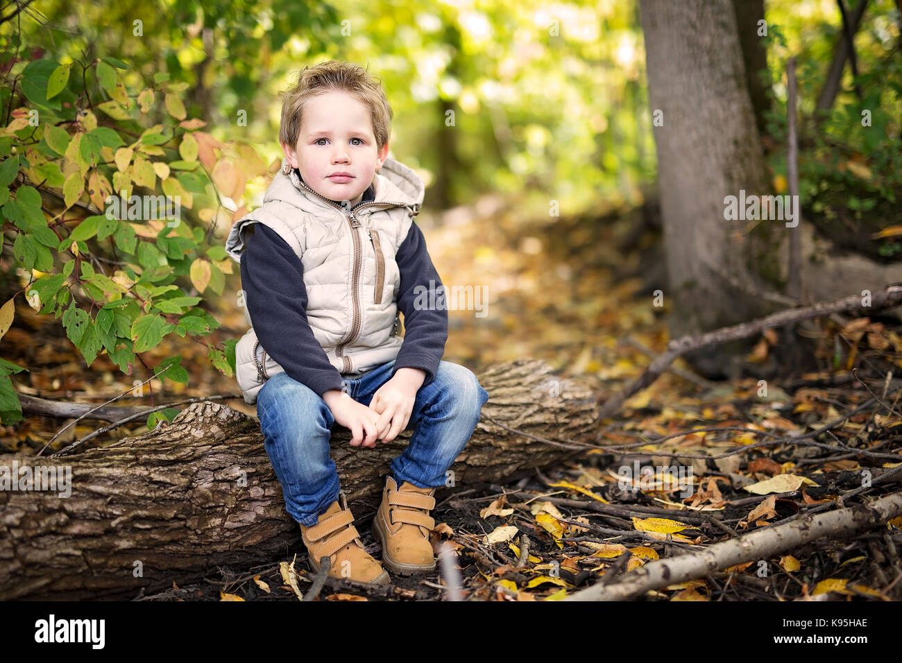 boy in autumn season in a park Stock Photo - Alamy