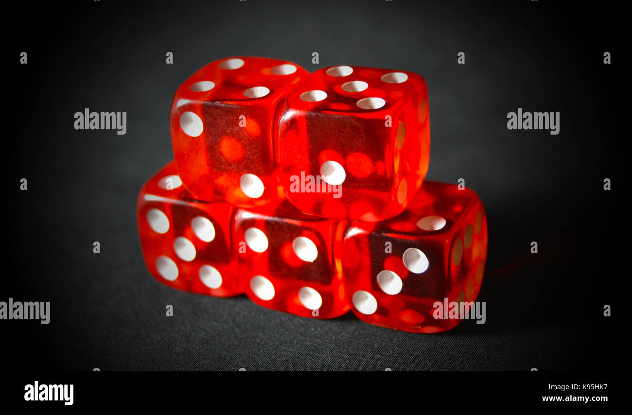Stacked Red dice with Black Background Stock Photo - Alamy