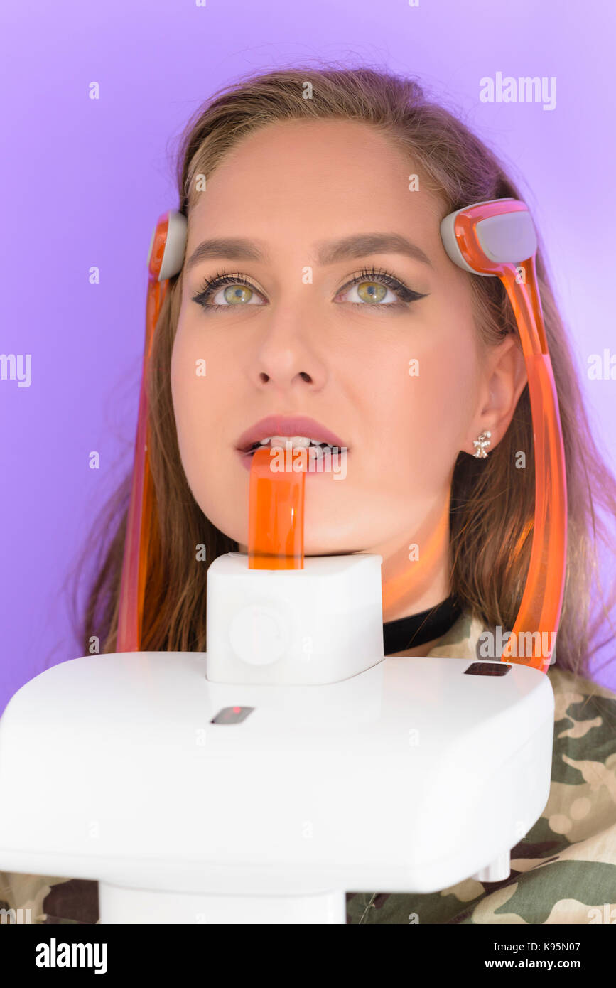 Beautiful young woman patient standing in x-ray machine Stock Photo - Alamy