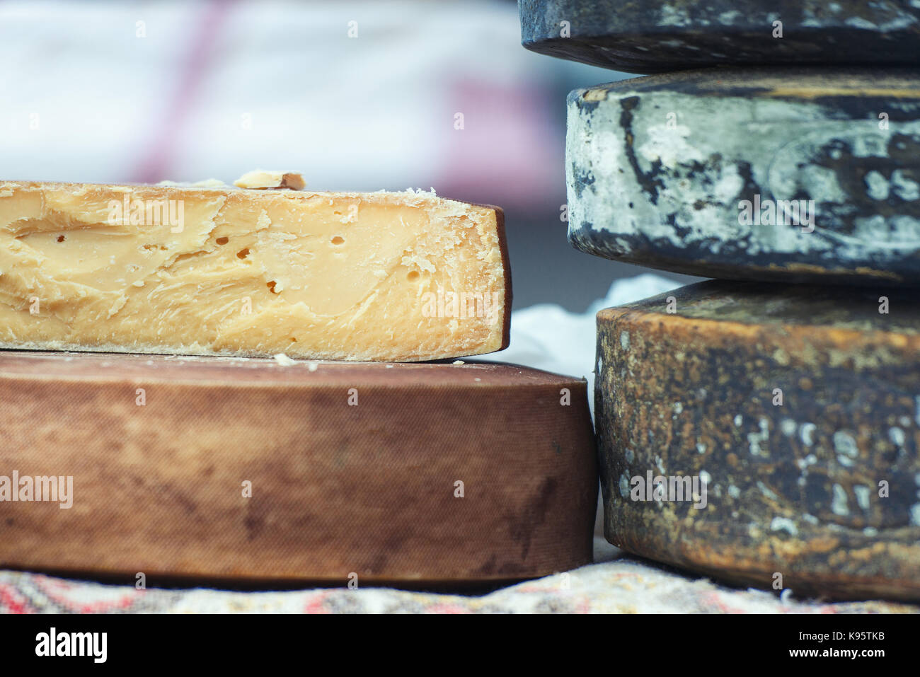Traditional artisan cheese wheels composition Stock Photo - Alamy