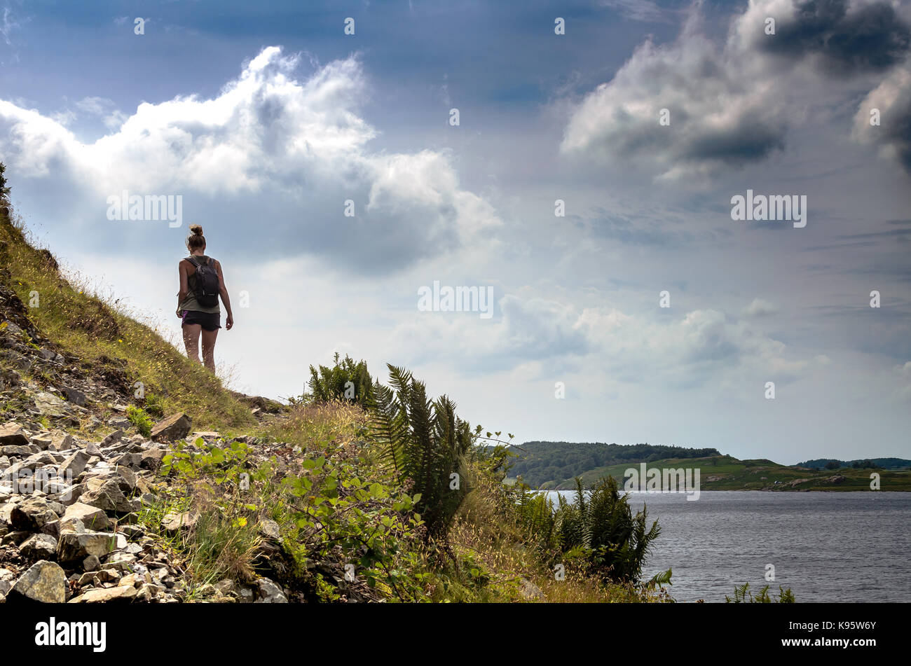 Woman walking by Wast Water Lake in the Lake District, Cumbria Stock ...