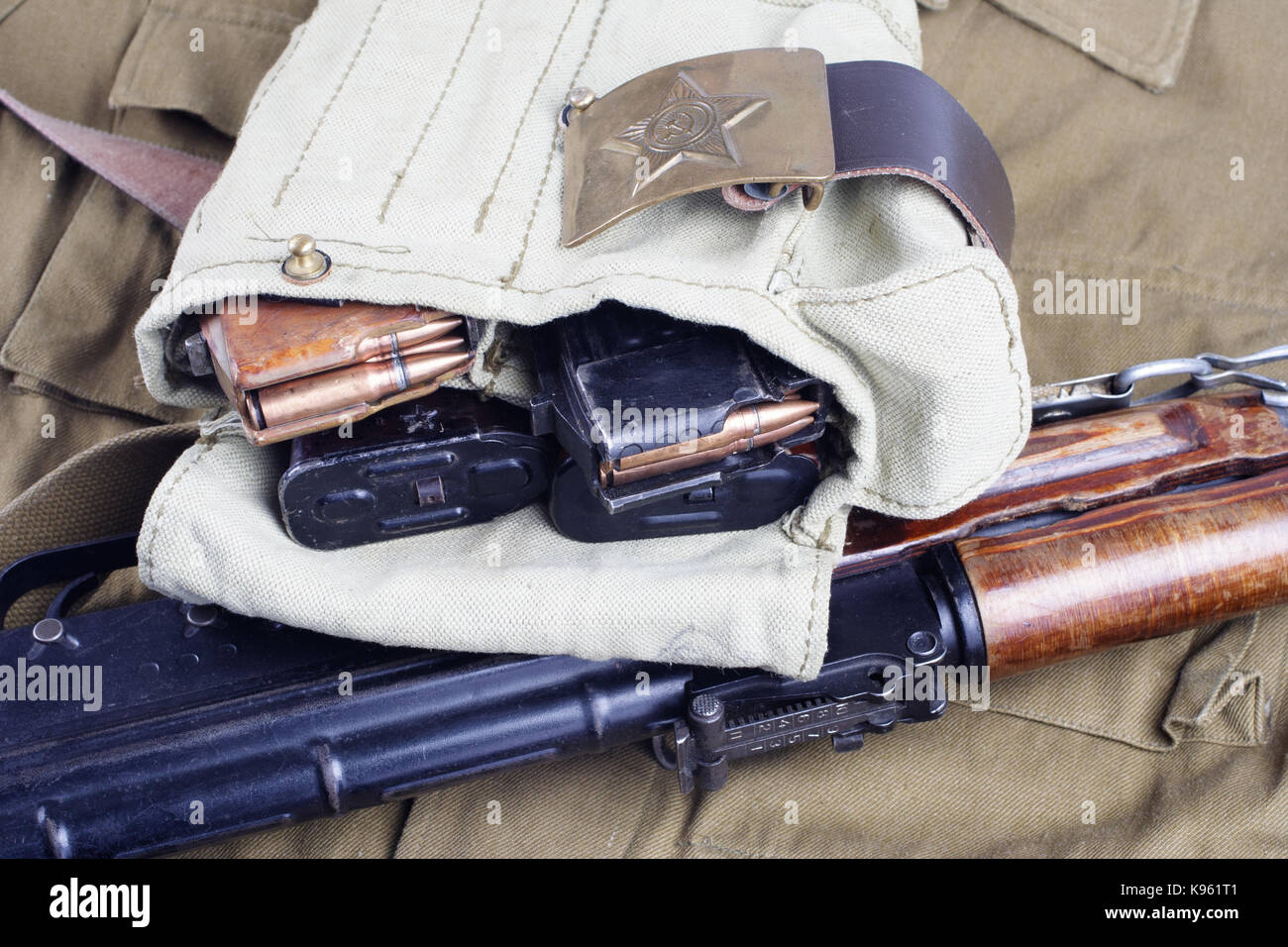 AK 47 on USSR Soviet Army khaki uniform background Stock Photo - Alamy