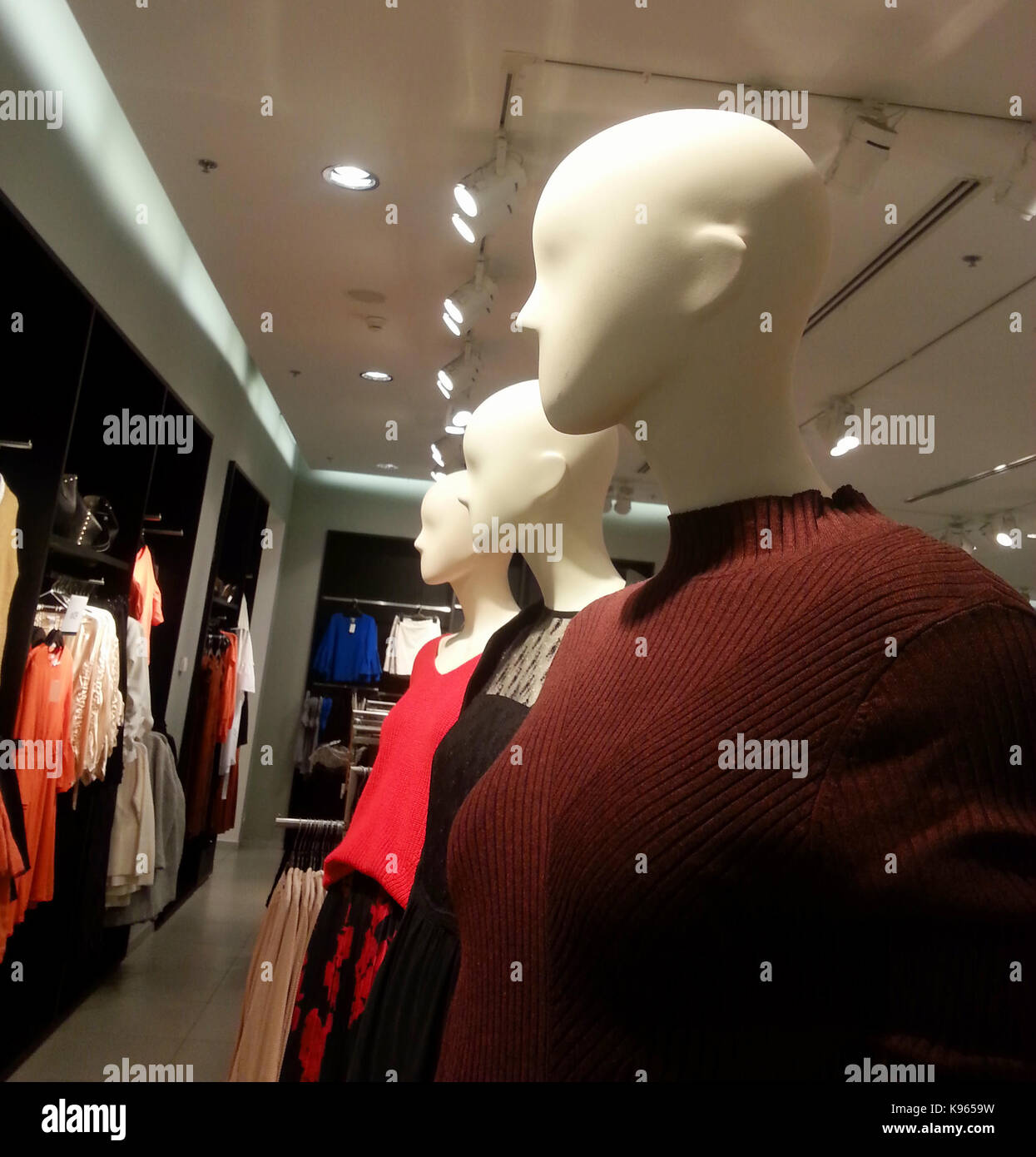 Mannequins on display in the shop with new fashion in shopping gallery ...