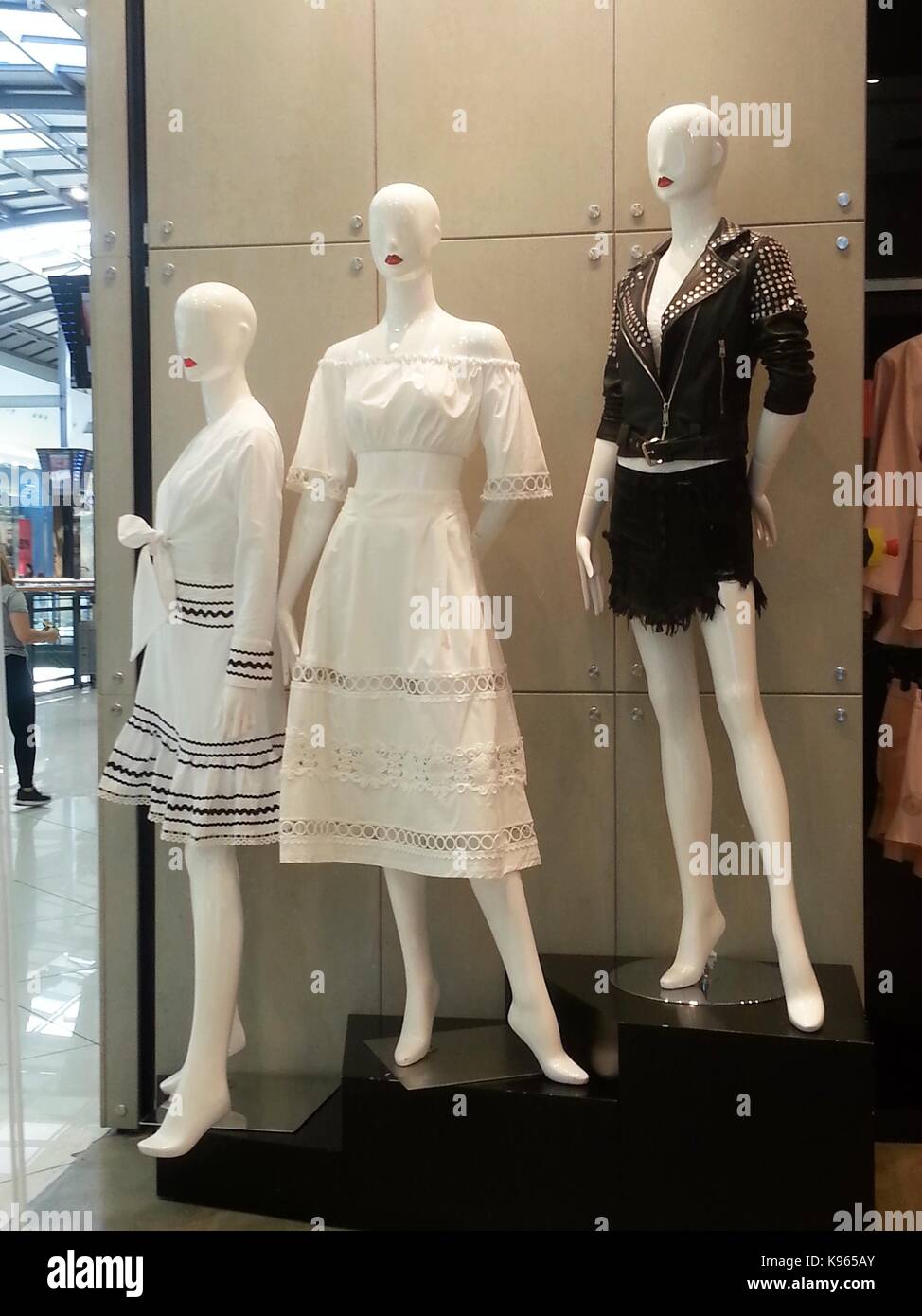 Mannequins on display in the shop with new fashion in shopping gallery ...
