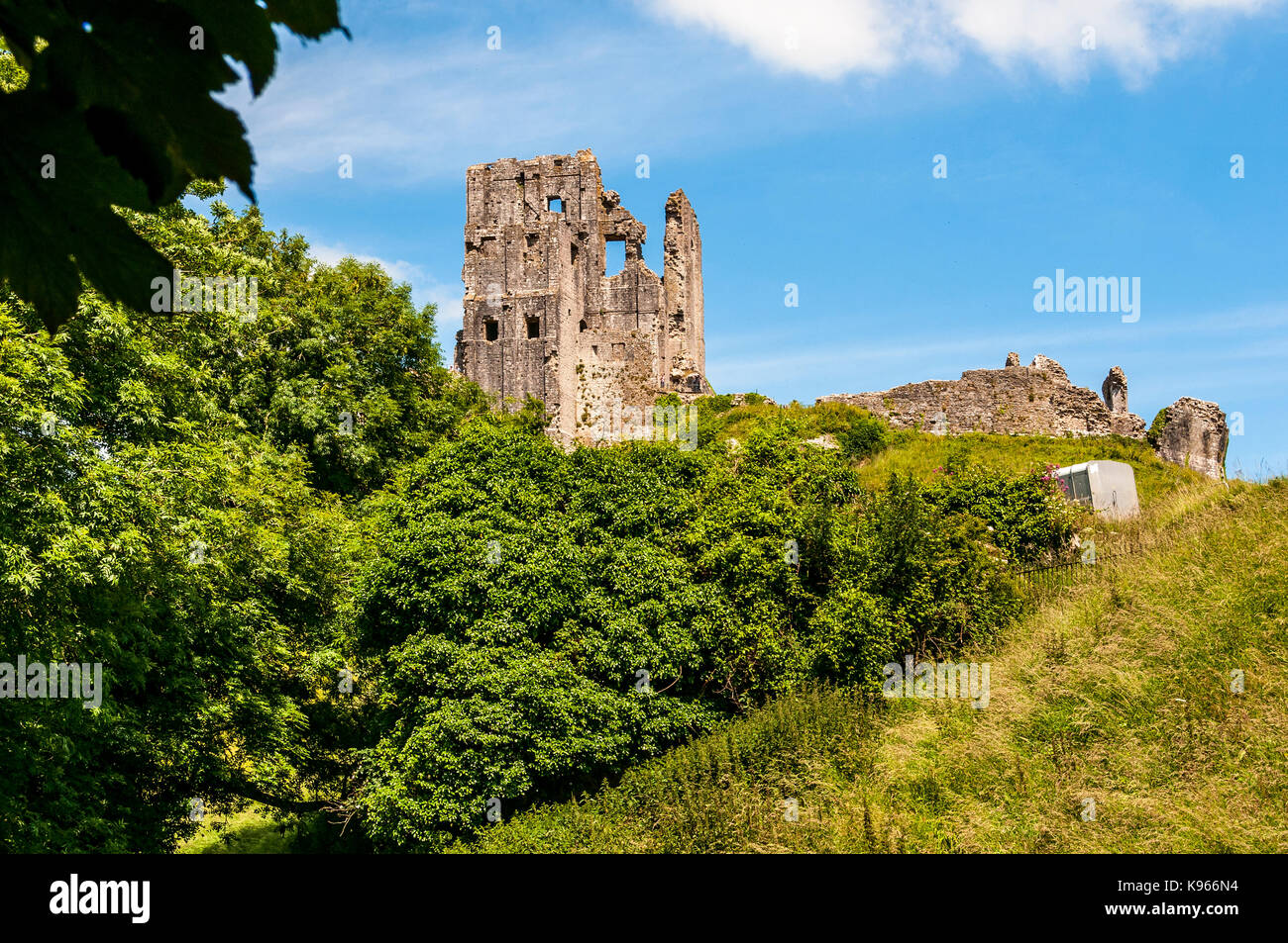 The Keep of the romantic ruins of ancient Corfe Castle standing above a ...