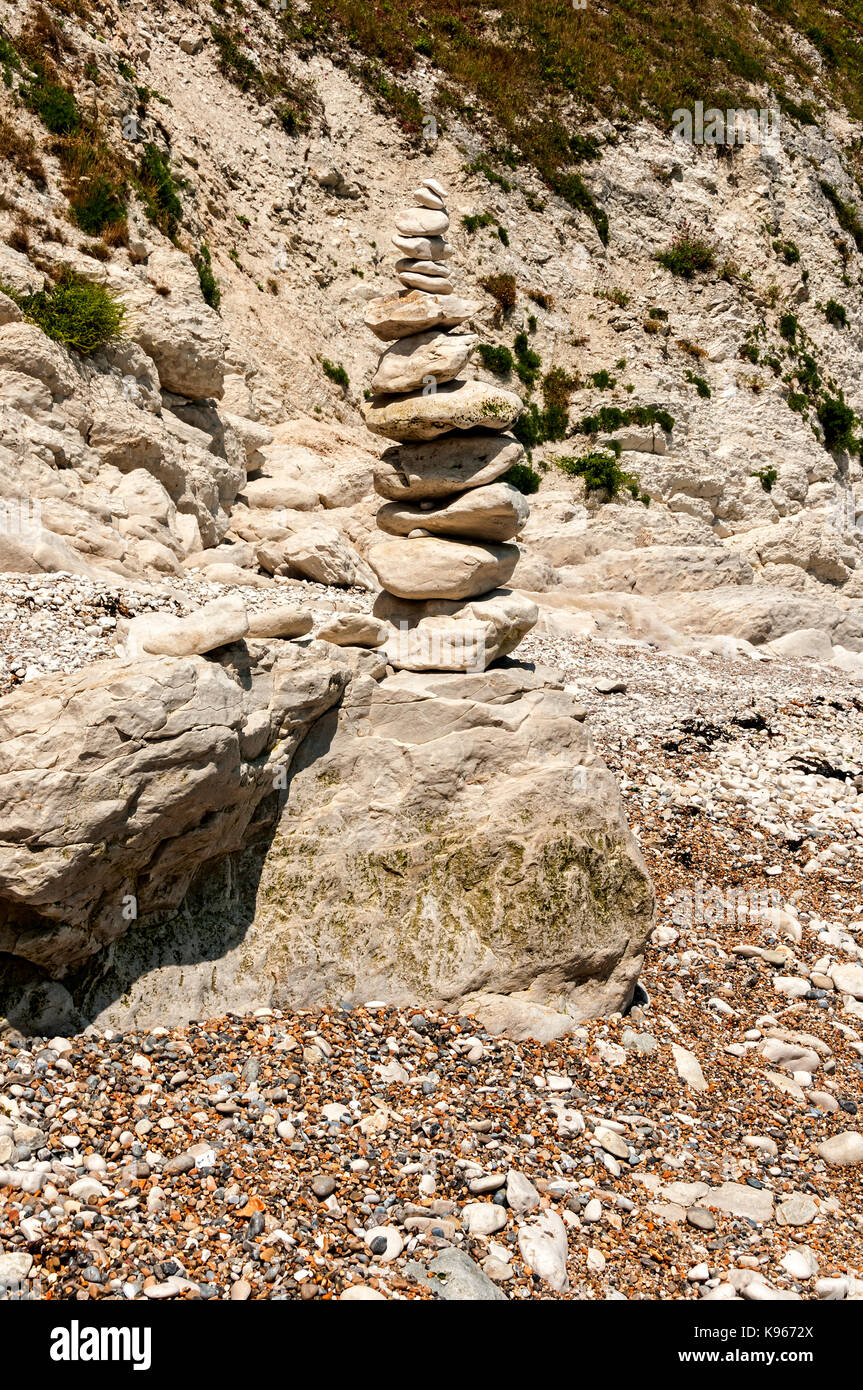 Large weathered rounded rocks placed one on top of another form a ...