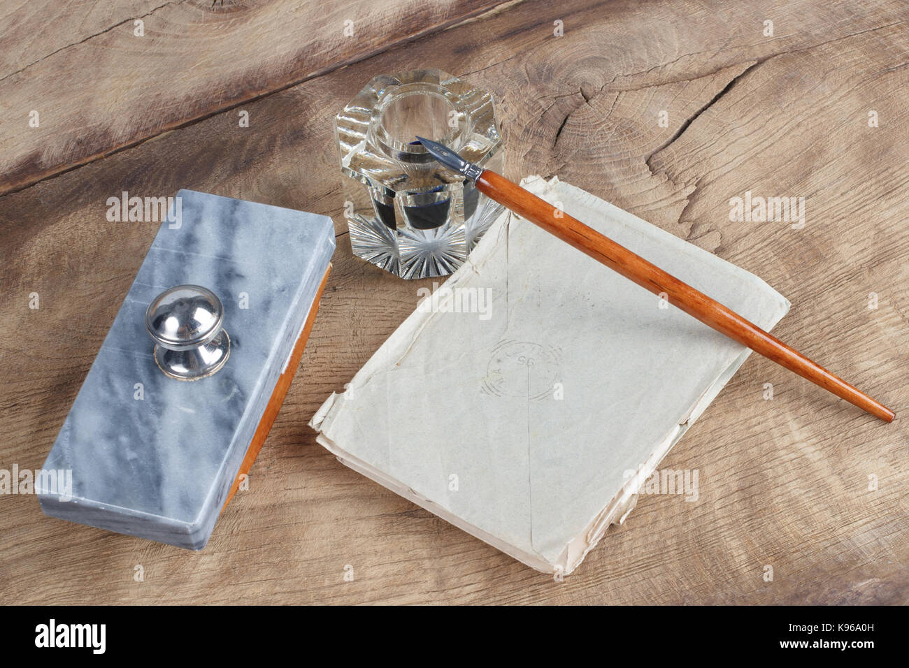 Vintage concept - Old fountain pen and inkwell with old letters on a ...