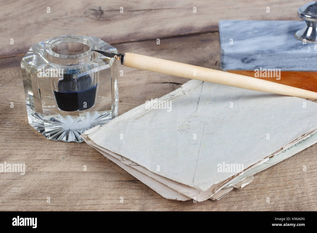 Vintage concept - Old fountain pen and inkwell with old letters on a ...