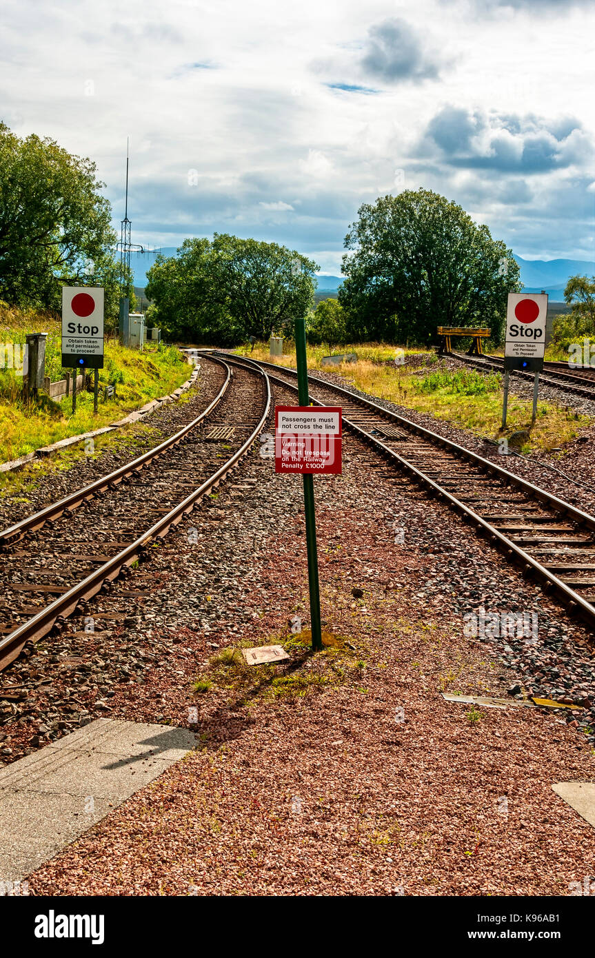 At the end of an island platform stop signs warn against crossing the ...