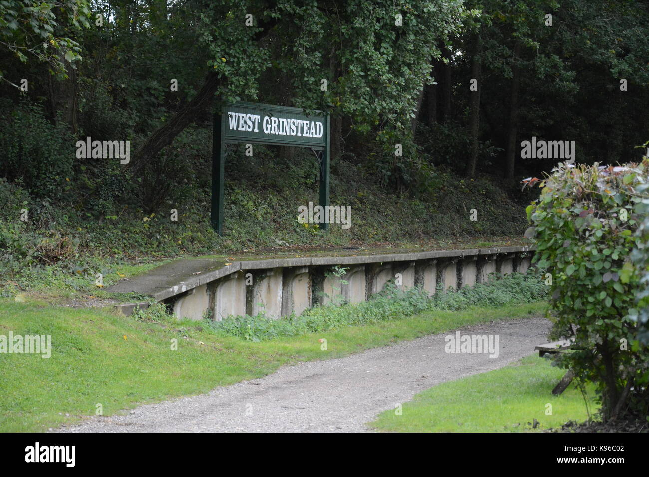 Platform and signage (non original) at disused Railway; West Grinstead ...