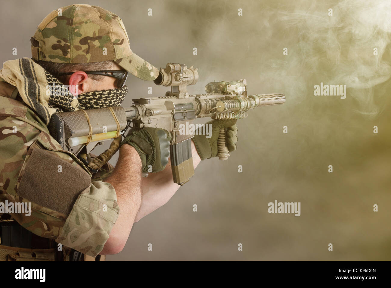 Private Military Company operator with assault rifle on white ...