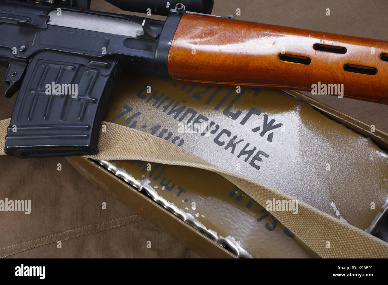 SVD sniper rifle with box of ammunition on canvas background. The ...