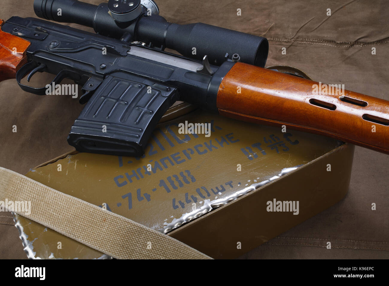 SVD sniper rifle with box of ammunition on canvas background. The ...
