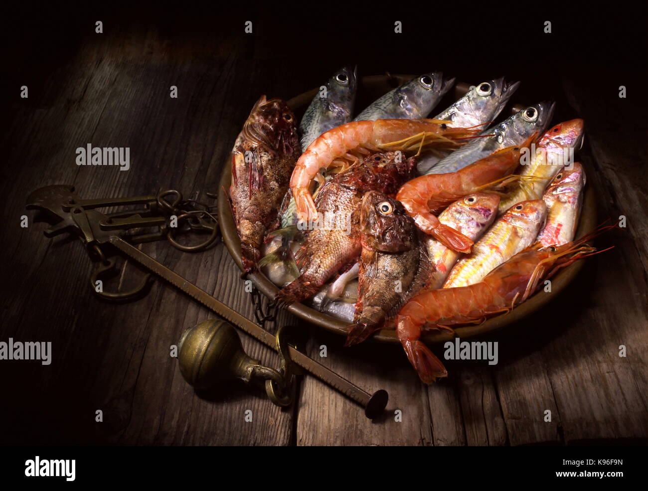 Still life with fresh fish on balance Stock Photo - Alamy