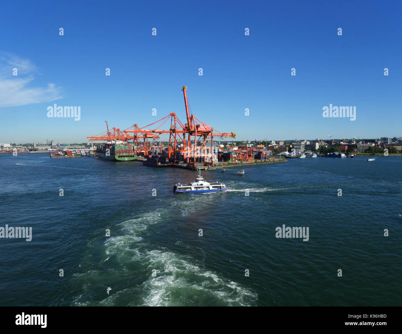A Seabus ferry crosses Coal Harbour, Port of Vancouver, BC, Canada ...