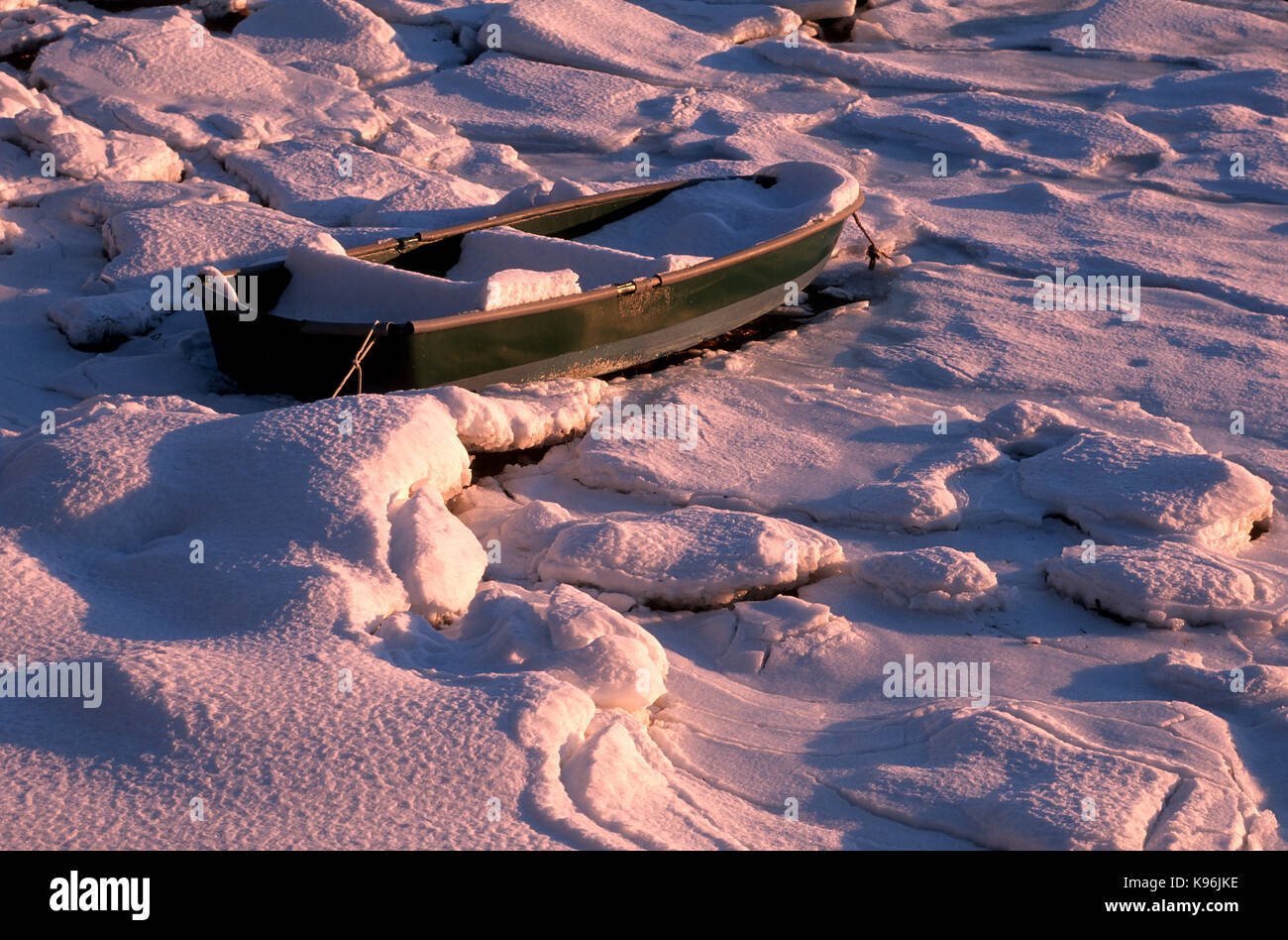 A rowboat frozen in the ice at Snug Harbor, Falmouth, Massachusetts ...