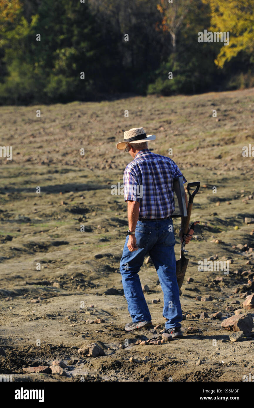 Man walks into the diamond field at Crater of Diamonds State Park in ...