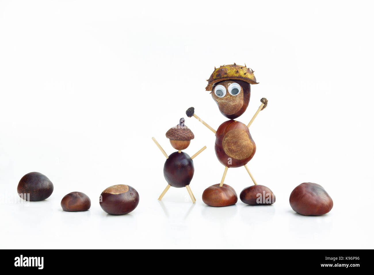Funny human shape character or figurine made with chestnuts in white ...