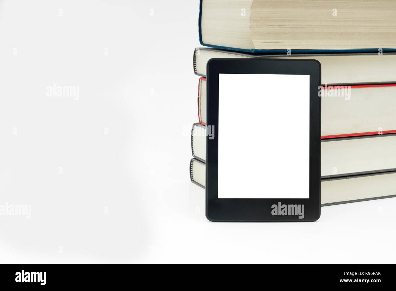 E-book device with books in white isolated background Stock Photo - Alamy