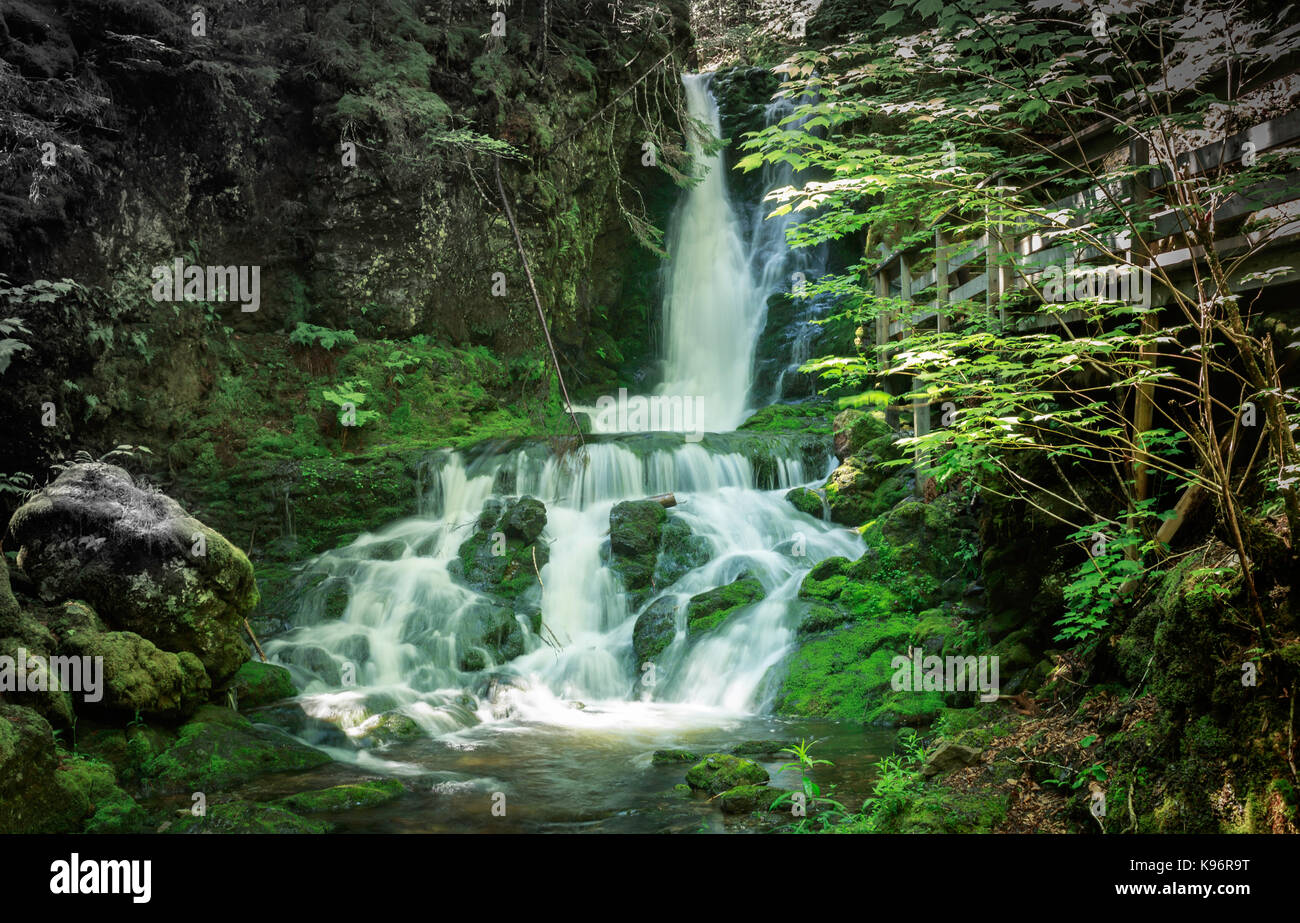 Silky look to waterfall as it cascades over rocks at Dickson Falls, New ...