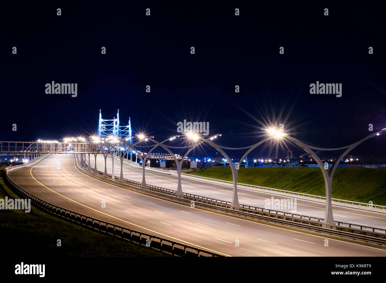Illuminated empty highway at night. Long exposure cityscape Stock Photo ...