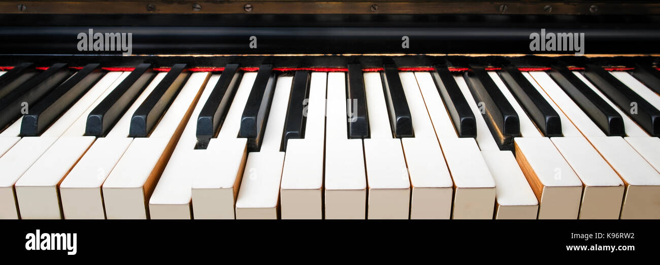 Old piano keys, pressed by themselves. Wide angle front view Stock ...