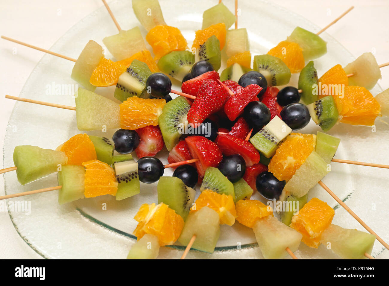 Fresh Fruits On Skewers Sticks For Party Stock Photo - Alamy