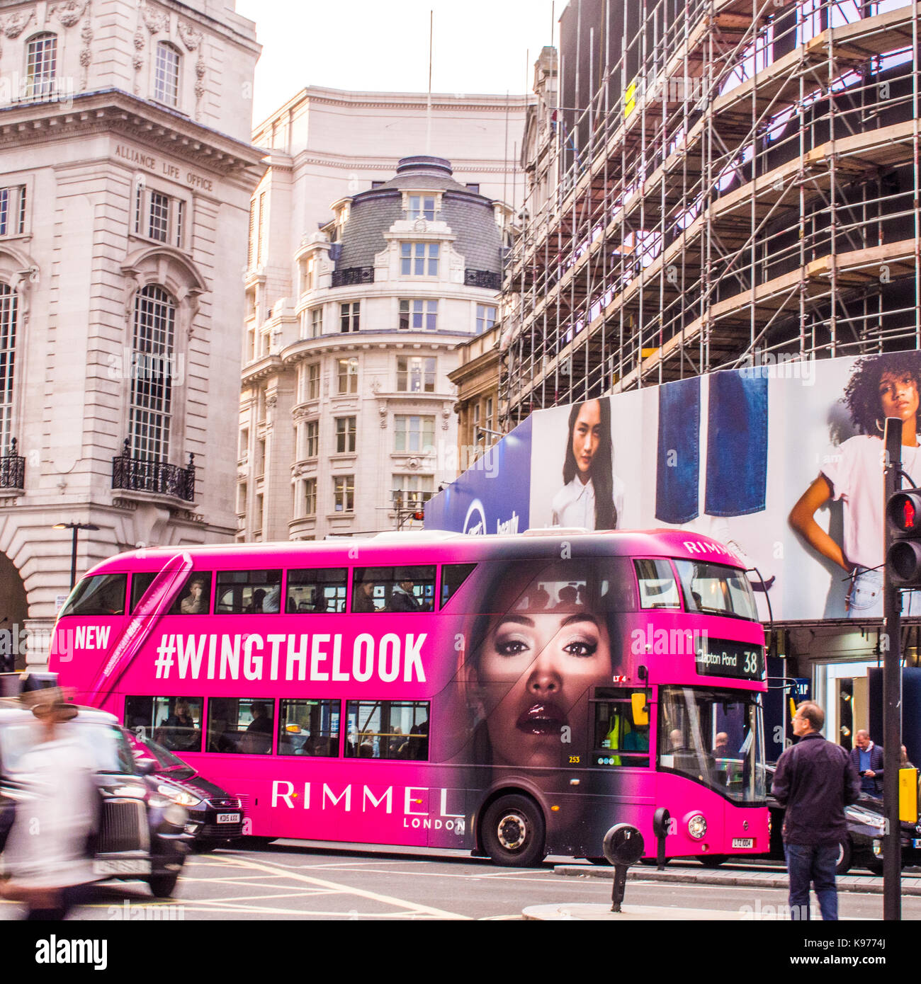 Purple coloured bus at Piccadilly Circus London Stock Photo - Alamy