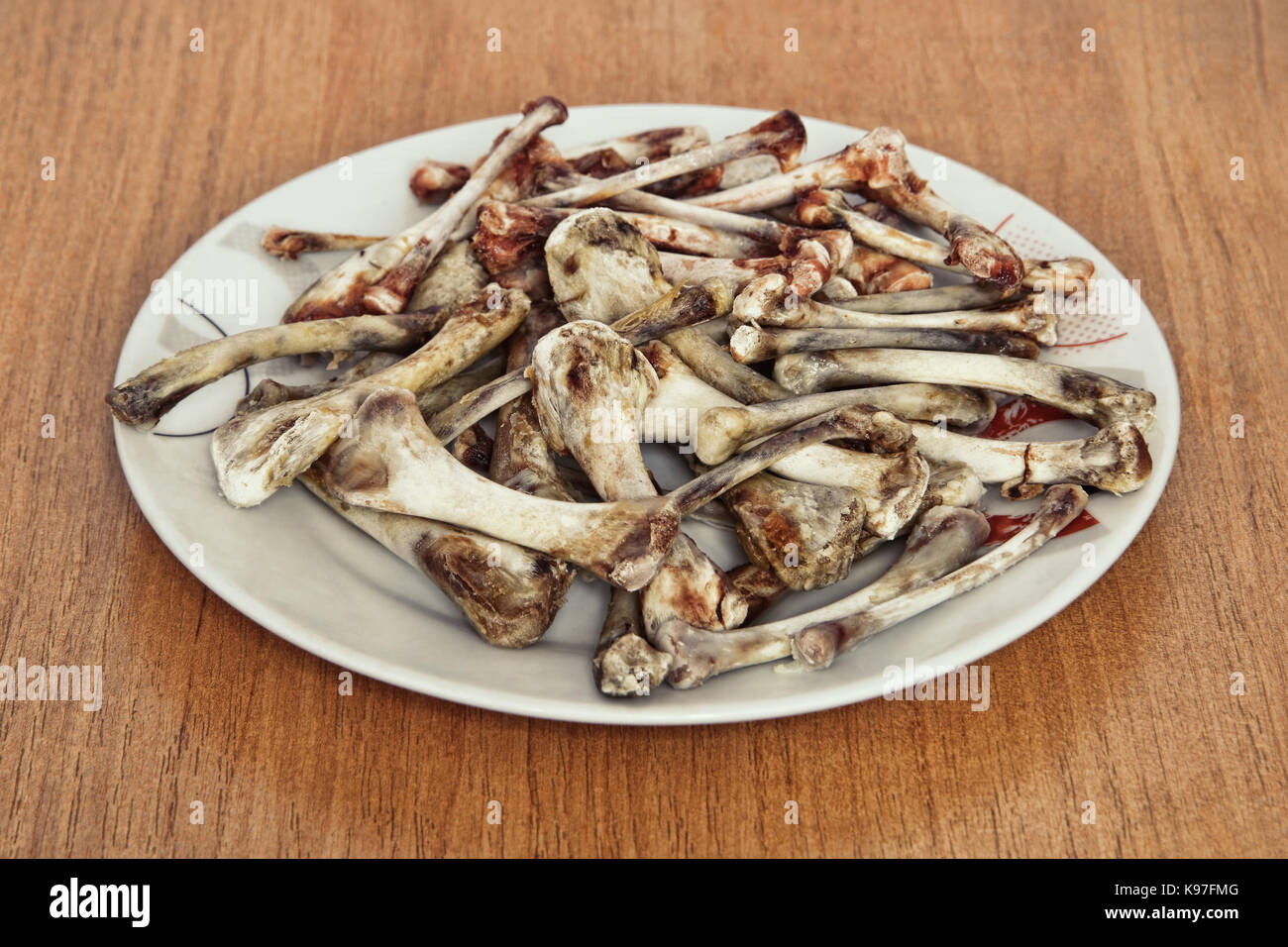 Chicken bones on plate leftovers hi-res stock photography and images ...