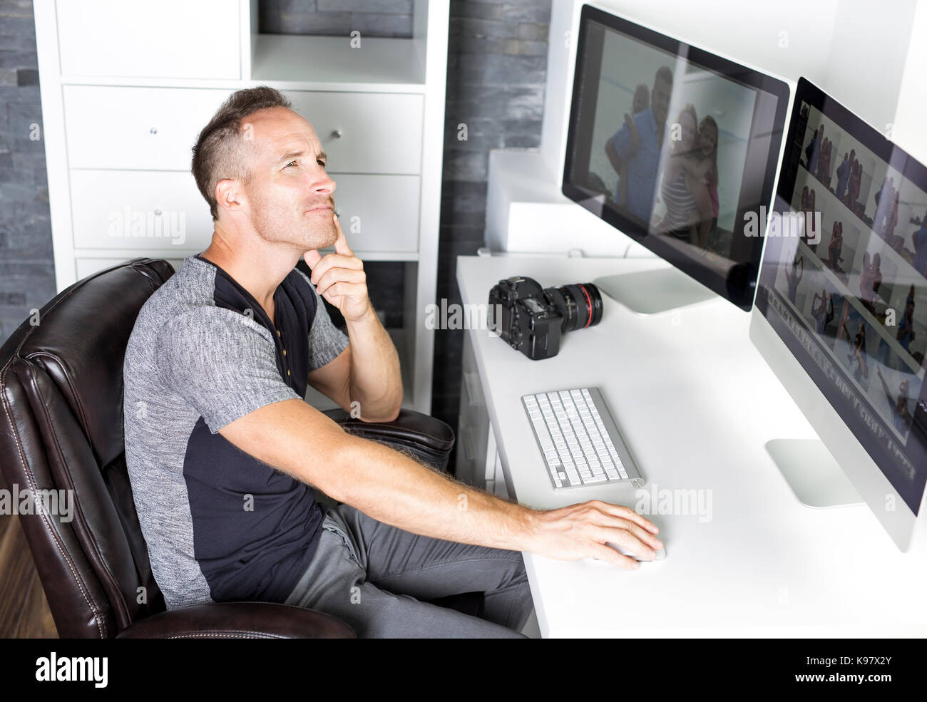 Handsome photographer camera office Stock Photo - Alamy