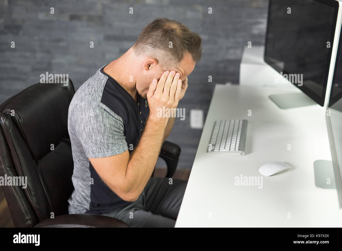 Young business man with problems and stress in the office Stock Photo ...