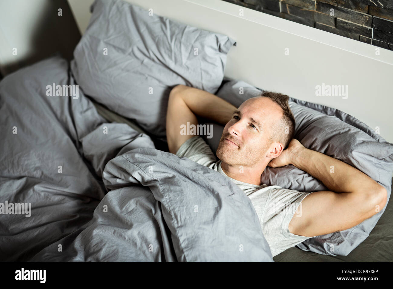 Portrait of a young man from above sleeping in bed Stock Photo - Alamy