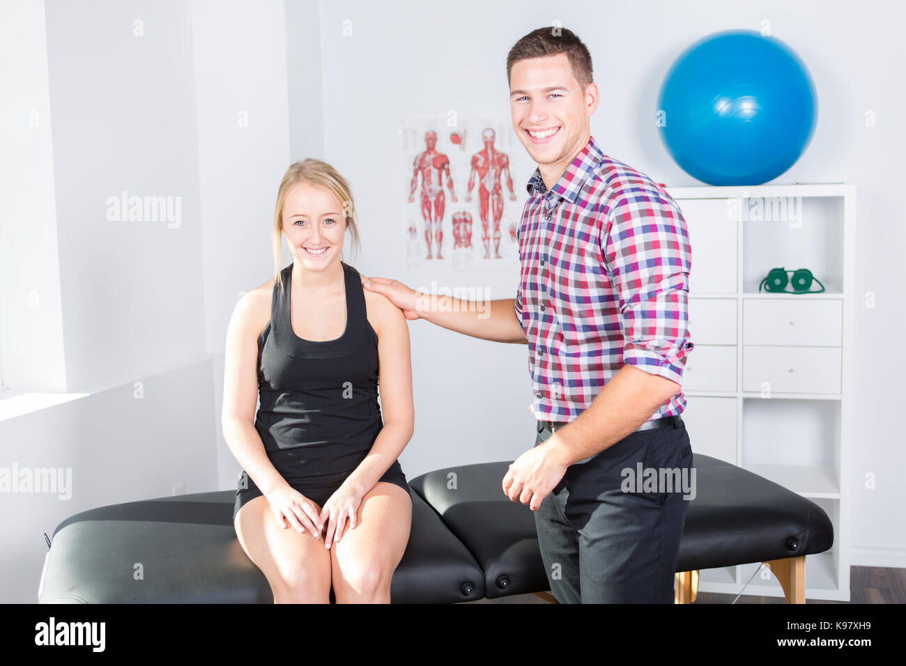 male physio therapist and woman helping patient Stock Photo - Alamy