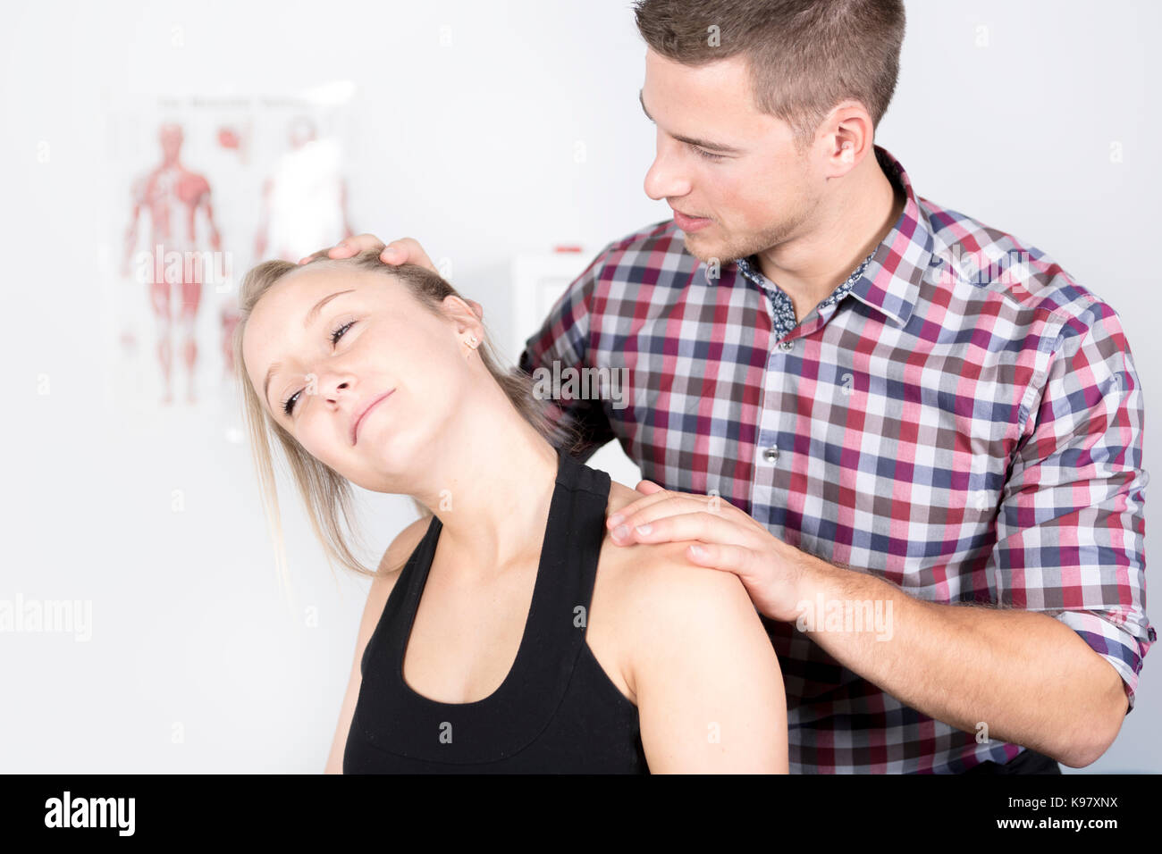 male physio therapist and woman helping patient Stock Photo - Alamy