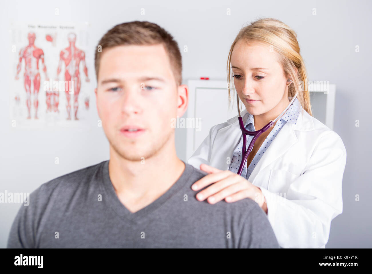 Doctor examining her patient in medical office Stock Photo - Alamy