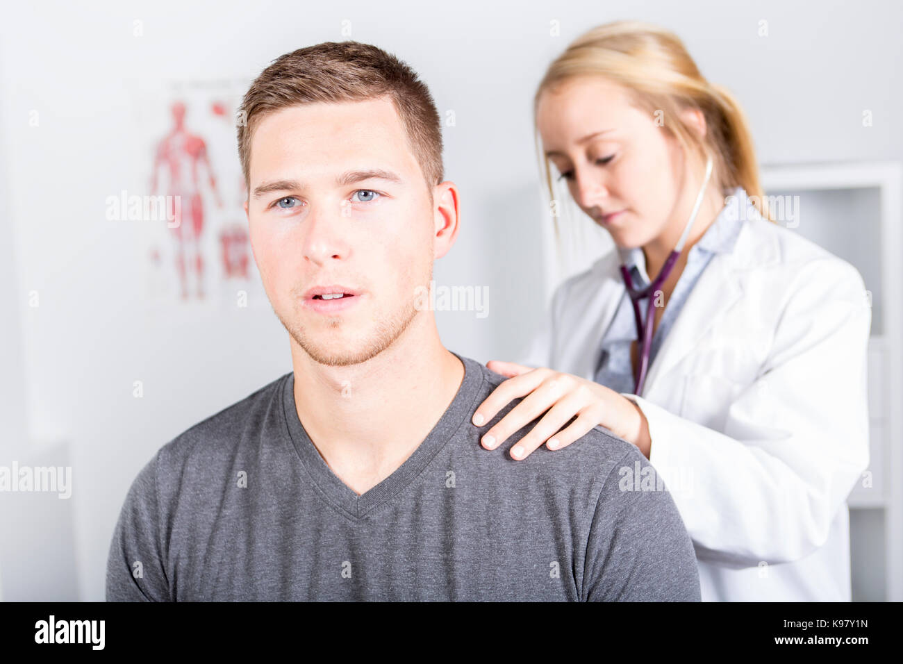 Doctor examining her patient in medical office Stock Photo - Alamy