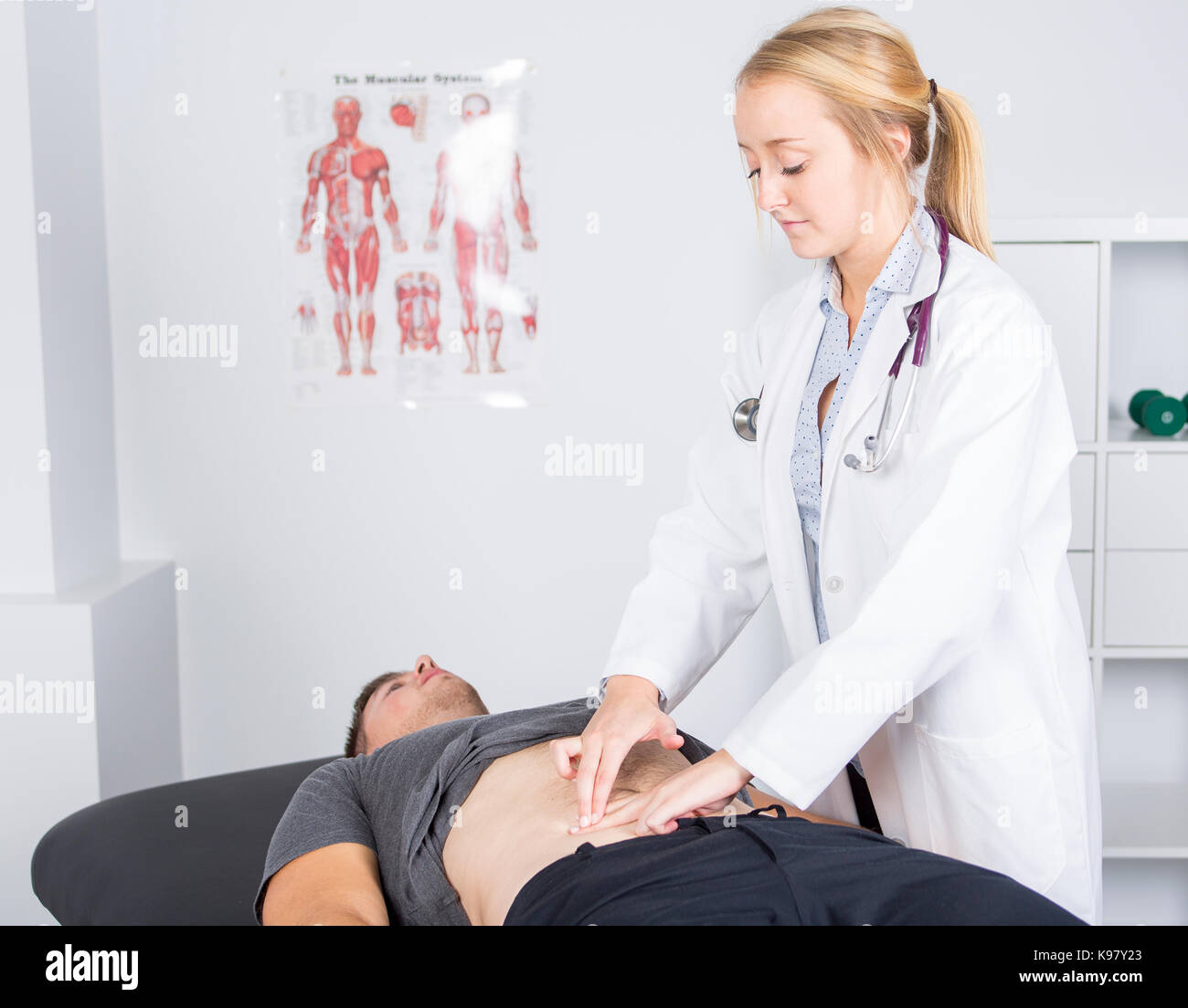 Doctor examining her patient in medical office Stock Photo - Alamy