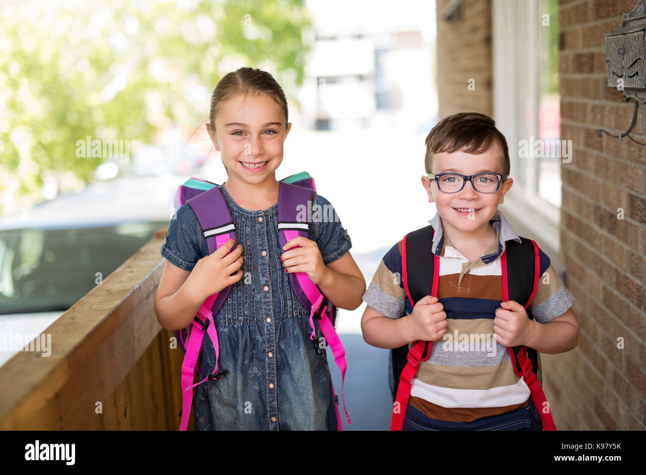Brother sister school go Stock Photo - Alamy
