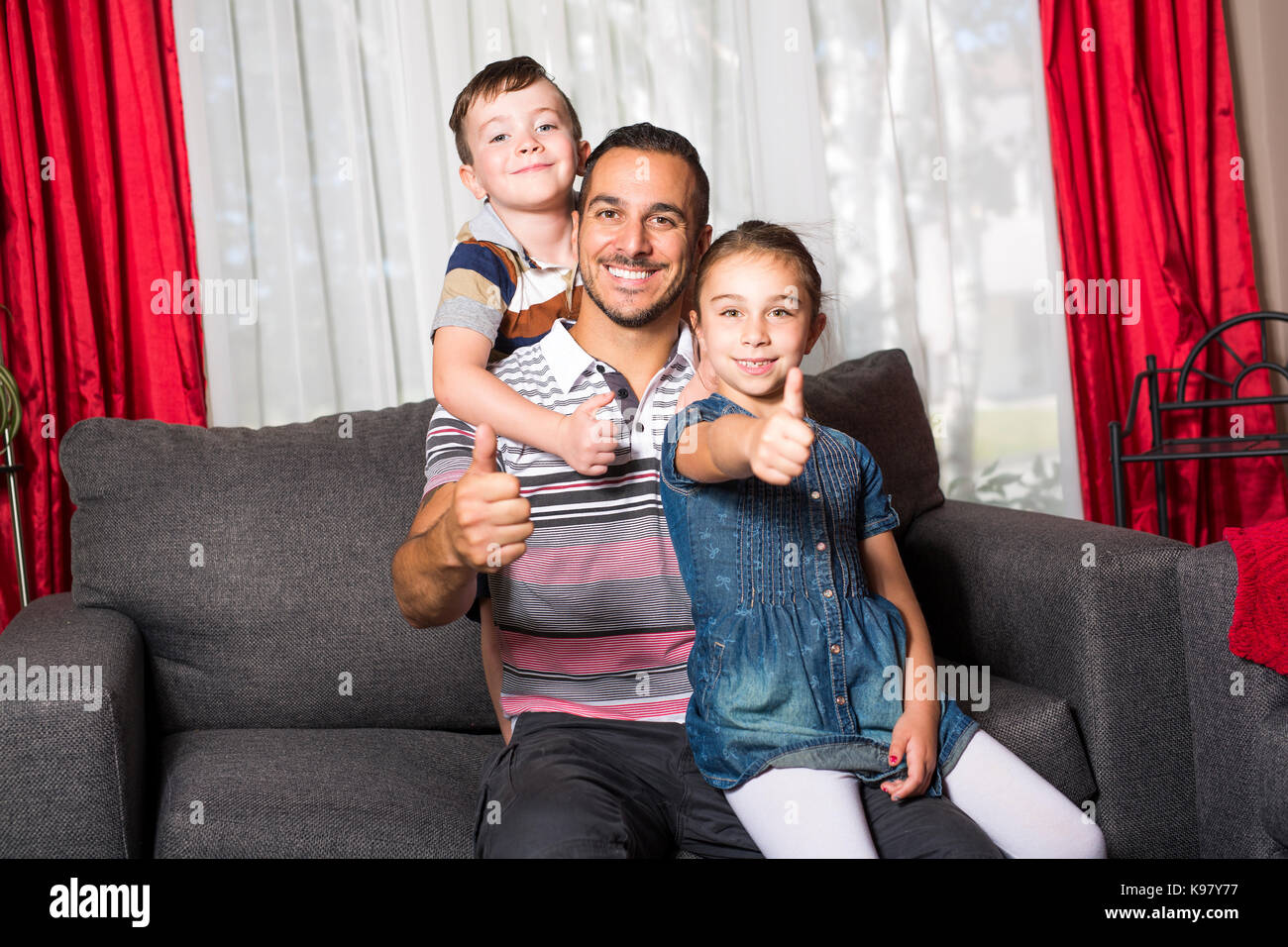Portrait of single daddy with 2 kids at home Stock Photo - Alamy