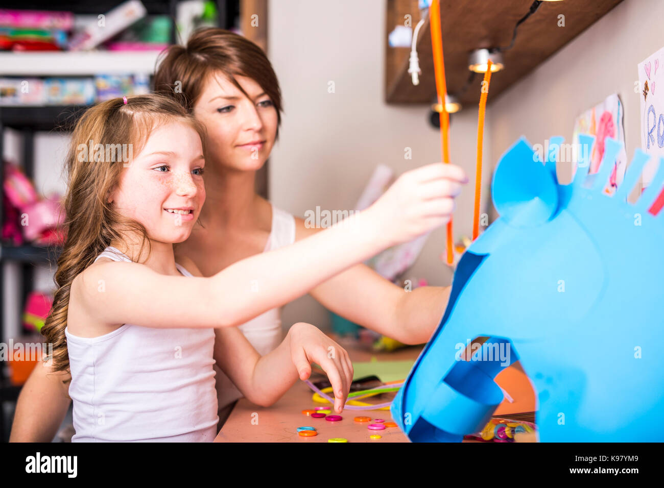 Young Girl use his imagination with cardboard Stock Photo - Alamy