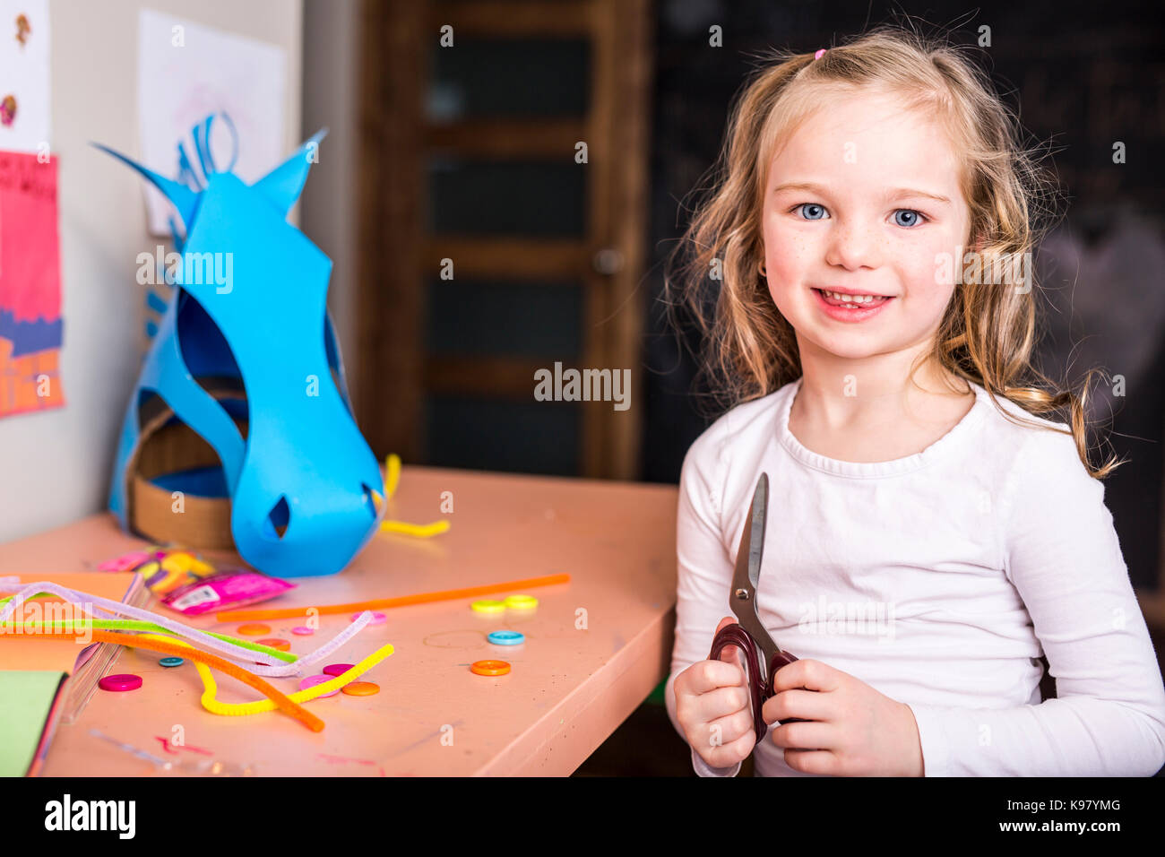Young Girl use his imagination with cardboard Stock Photo - Alamy