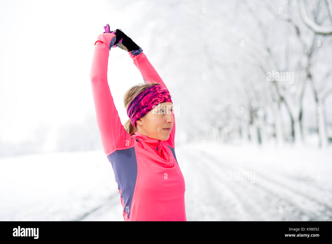 A Fitness running woman in winter season Stock Photo - Alamy