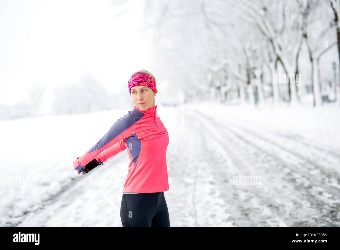 A Fitness running woman in winter season Stock Photo - Alamy