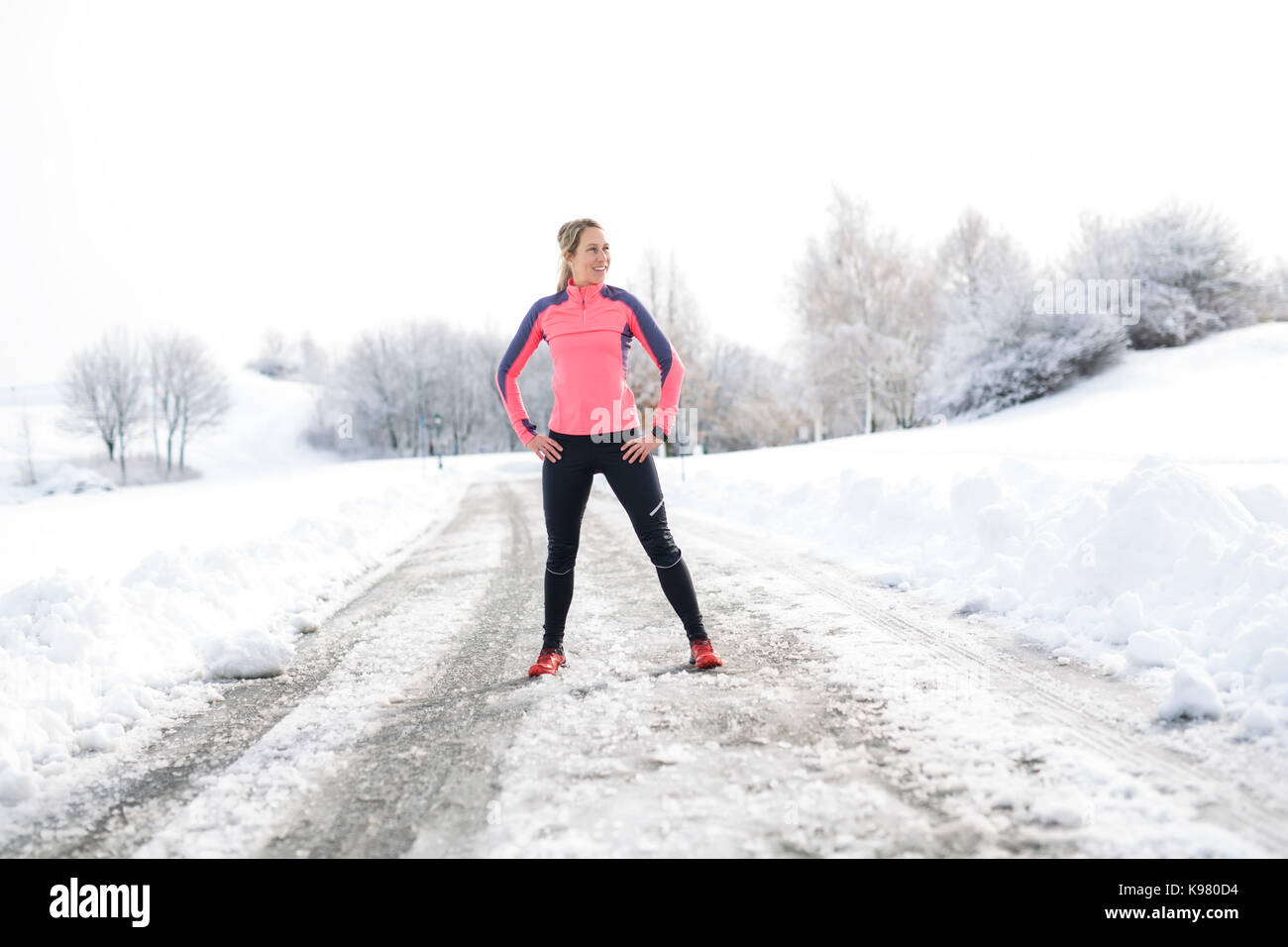 A Fitness running woman in winter season Stock Photo - Alamy