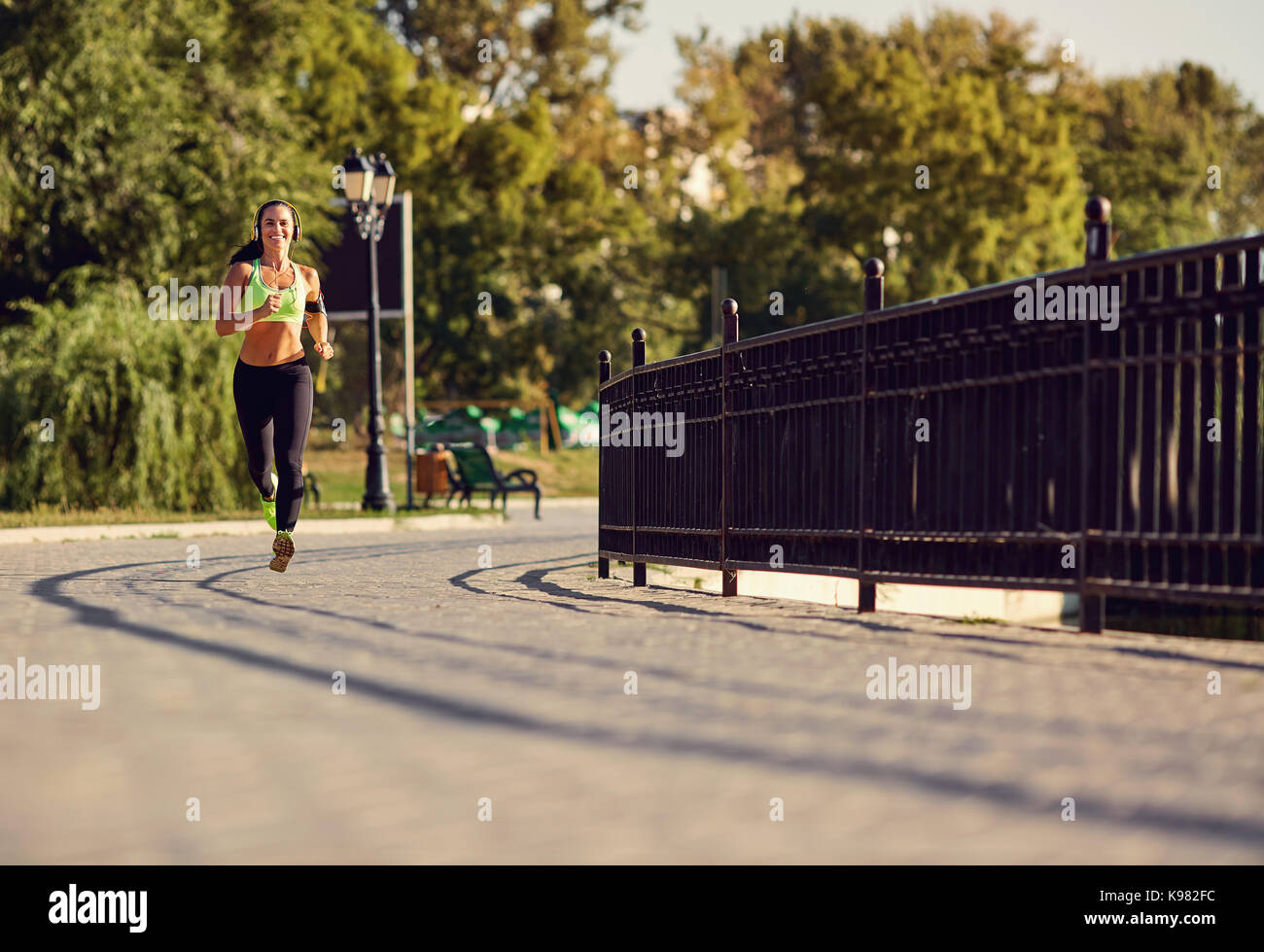 A girl jogging in the park Stock Photo - Alamy