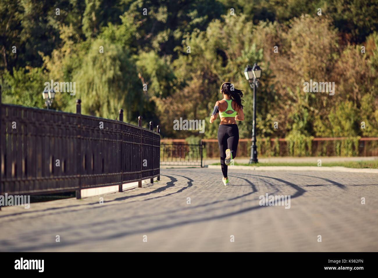A girl jogging in the park Stock Photo - Alamy