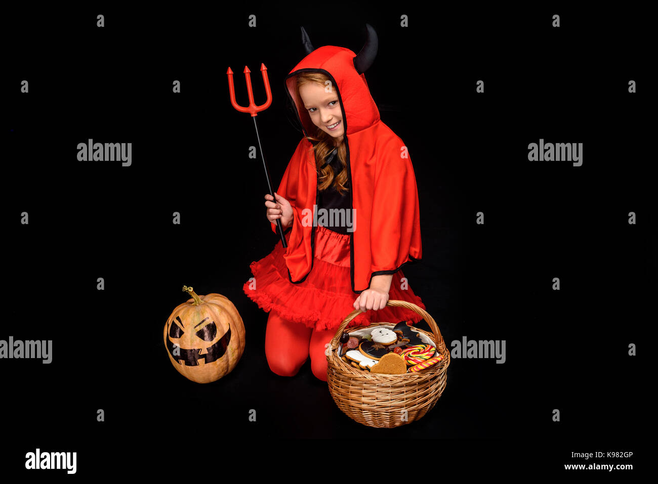child with sweets in basket Stock Photo - Alamy