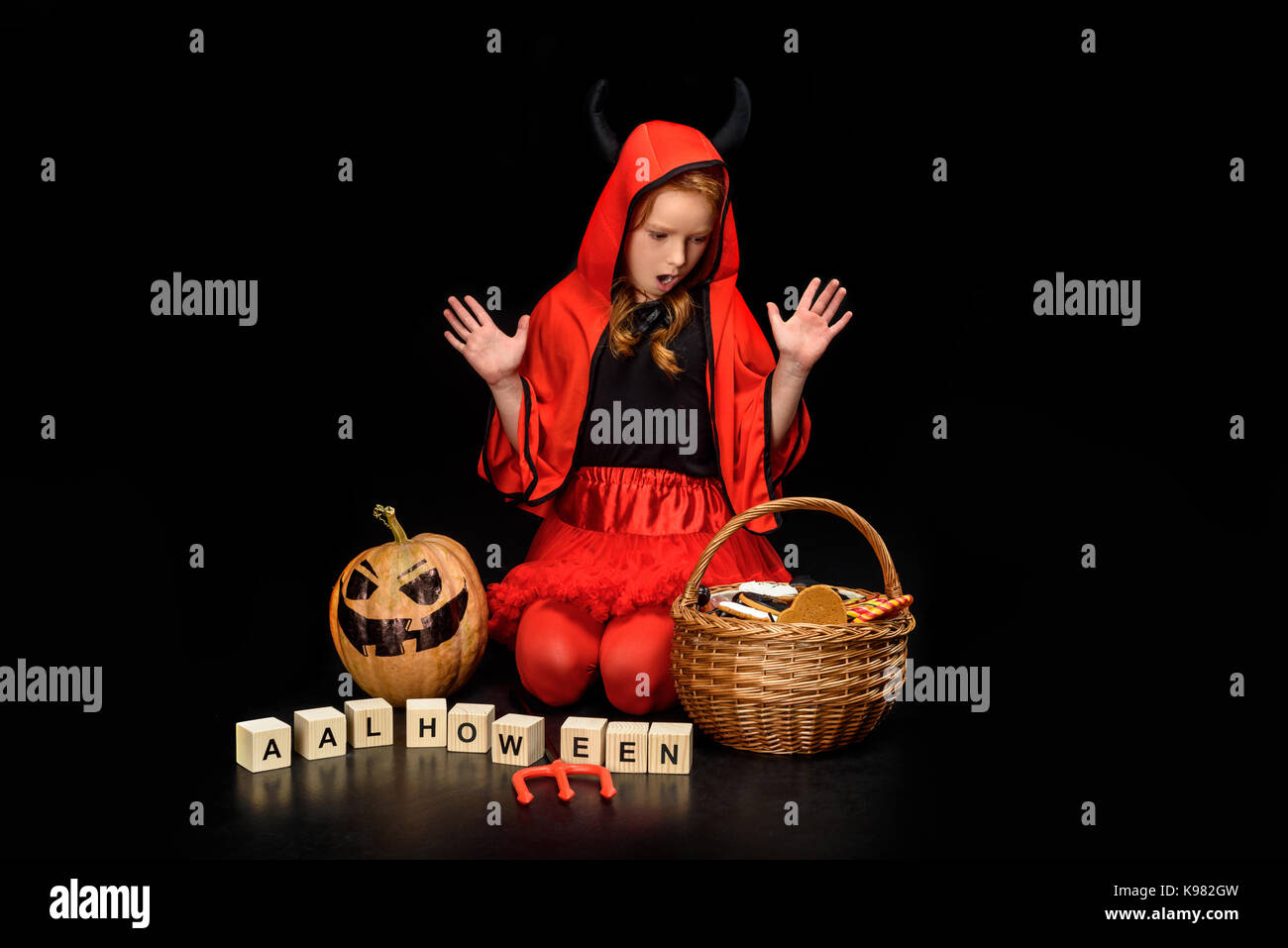 shocked child in costume of devil Stock Photo - Alamy